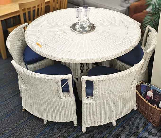 A complete wicker dining set that's ready to transform your patio into a summer paradise.