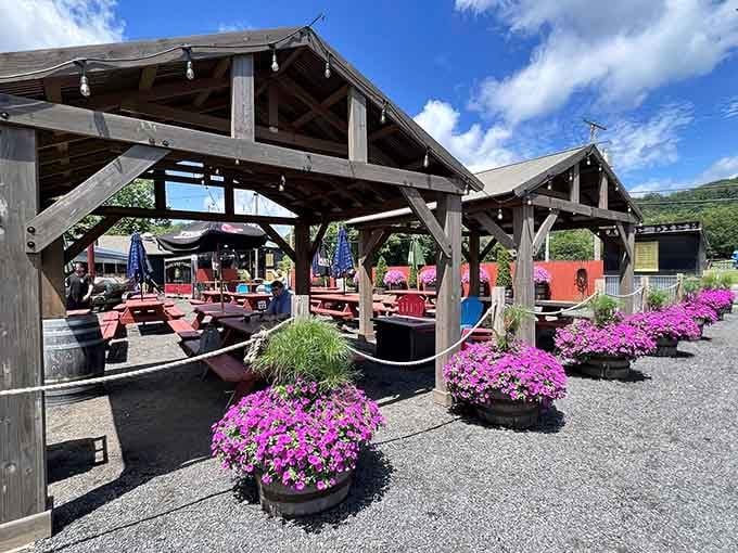 Covered outdoor seating surrounded by flowers makes eating BBQ feel like a proper summer celebration worth repeating.