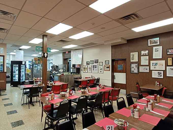 The dining room awaits with numbered tables and pink placemats, ready for your sandwich pilgrimage today.