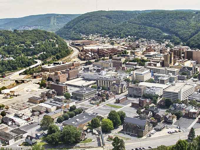 Aerial views reveal how mountains cradle this resilient city, creating a natural amphitheater that's been hosting the human drama for generations.