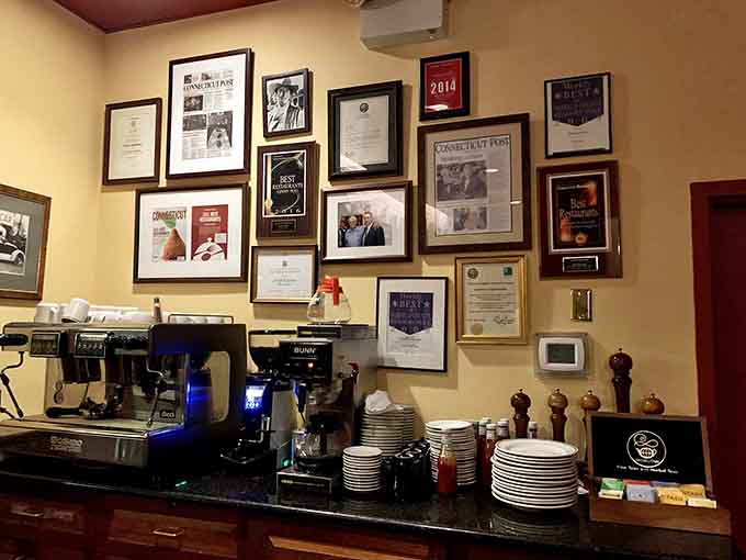 The coffee station surrounded by awards and accolades, telling the story of a restaurant that's earned its stellar reputation over time.