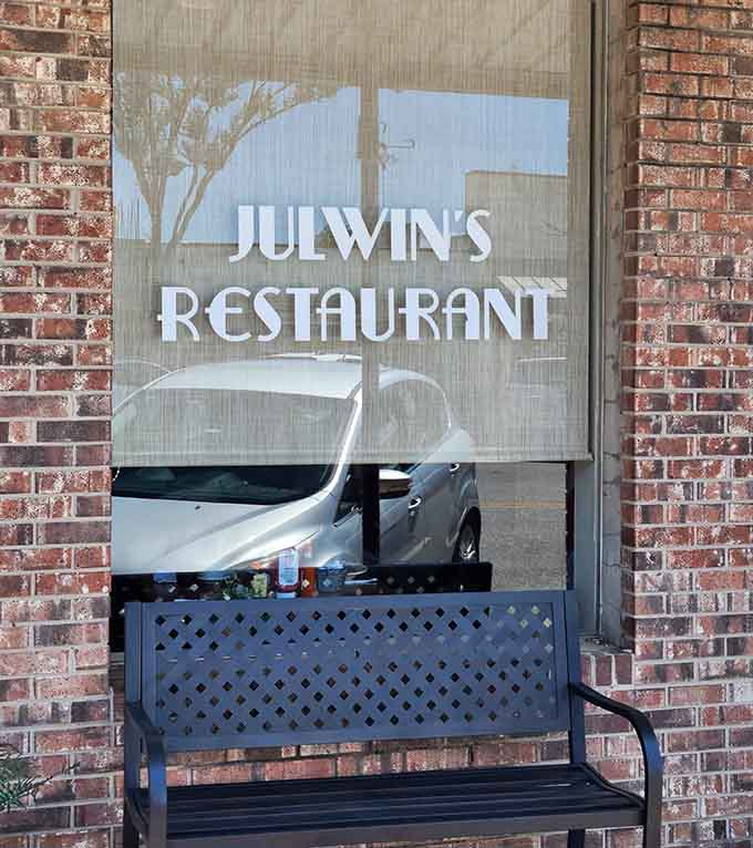 Simple signage on brick announces Baldwin County's oldest restaurant secret that locals have been keeping way too quiet.