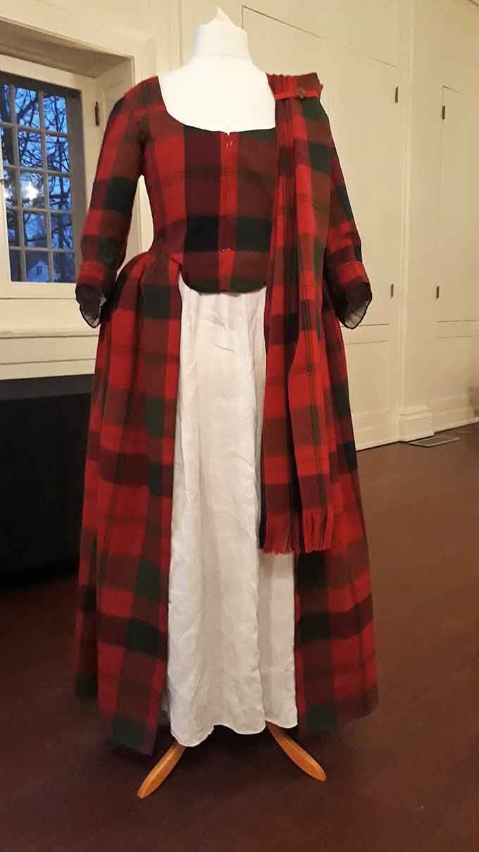 This buffalo plaid gown proves our ancestors had serious style, even when central heating was still science fiction.