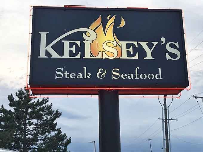 The roadside sign with flames beckons hungry travelers like a delicious beacon of hope.