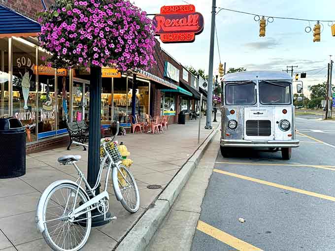 Downtown Inman's charming streetscape where a vintage bicycle and classic sign create the perfect small-town postcard scene.