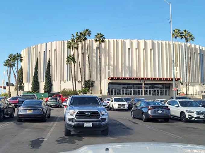 The vintage Sports Arena stands ready to host another weekend of commerce, its parking lot transformed into marketplace magic.