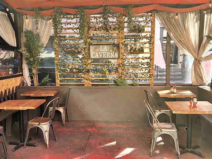 Outdoor seating that proves La Caverna knows not everyone wants to eat underground, though they're missing out.