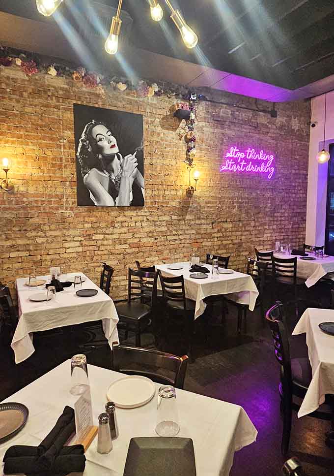 White tablecloths and artistic black-and-white photography elevate the dining experience without adding unnecessary stuffiness to the atmosphere.