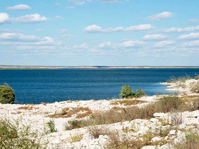 Endless blue water under cotton candy clouds creating the kind of scene that makes cameras very happy.