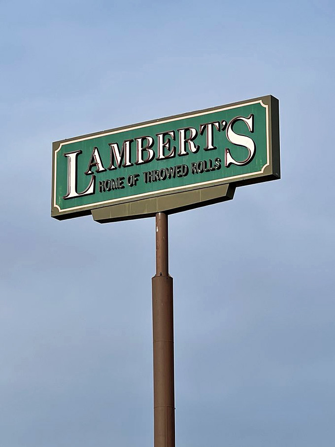 That classic roadside sign pointing skyward has guided hungry travelers to hot rolls and hospitality for longer than most restaurants survive.