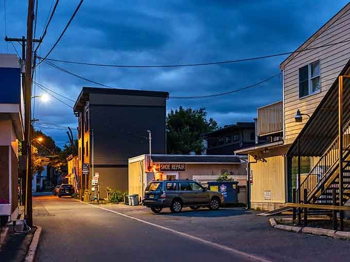 Evening lights illuminate quiet streets where the pace of life slows to something resembling actual sanity for once.