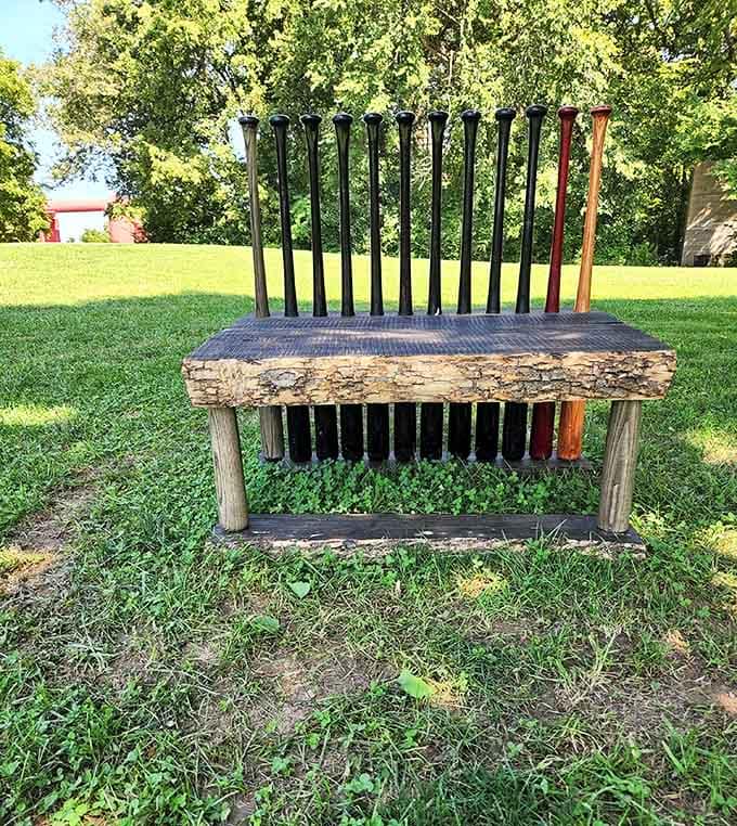 Baseball bats transformed into functional art, proving that even benches can hit it out of the park here.