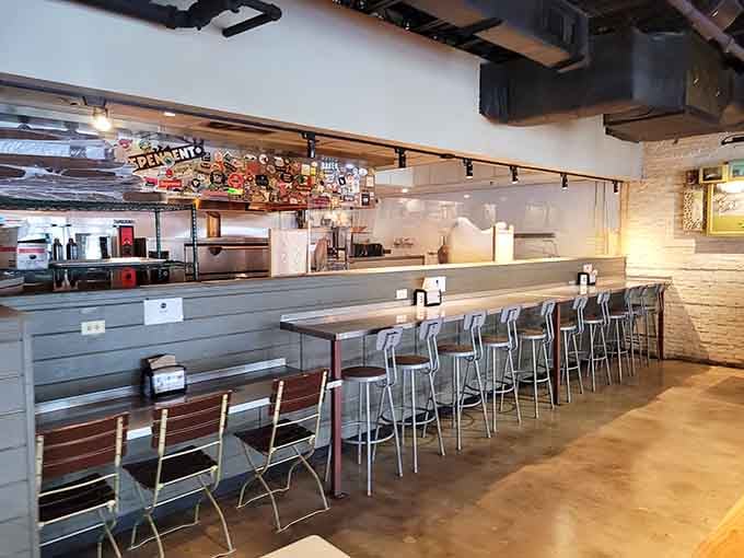 Counter seating with a front-row view of the kitchen magic, where ordinary ingredients become extraordinary slices.