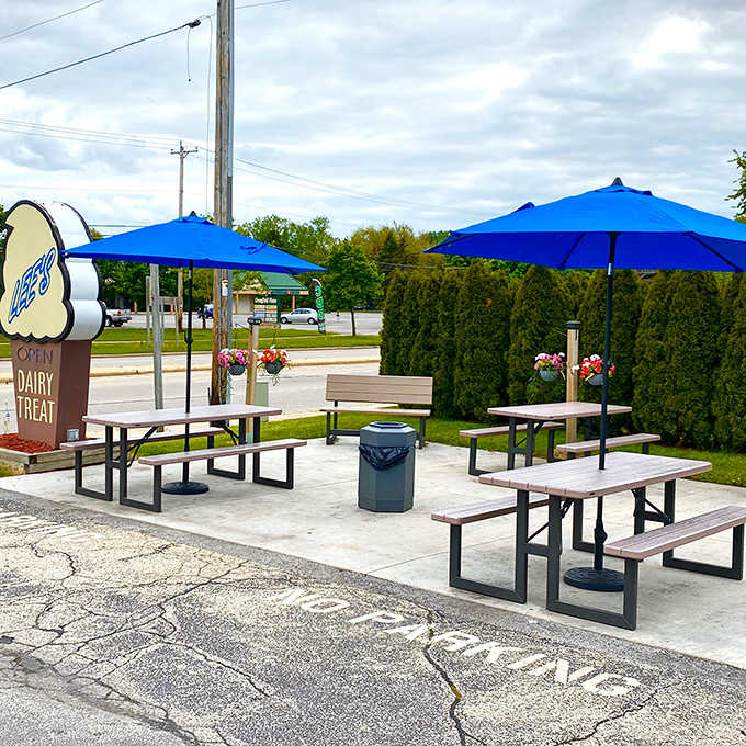 Picnic tables with bright blue umbrellas create the perfect spot to enjoy your cone while watching the world go by.