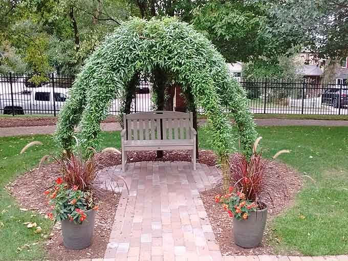 A vine-covered archway and bench offering the perfect spot to rest and contemplate what you've just experienced.