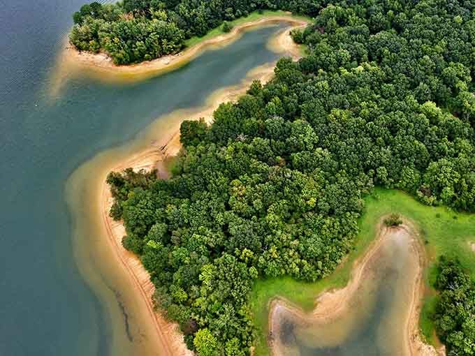 Aerial views reveal the shoreline's curves, where water meets land in an endless natural dance.