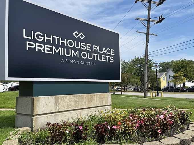 The Lighthouse Place Premium Outlets sign welcomes you to a shopping destination that actually respects your budget.