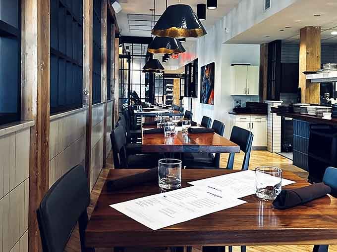 Modern dining spaces that honor historic bones with contemporary style, creating restaurants that feel both timeless and current.