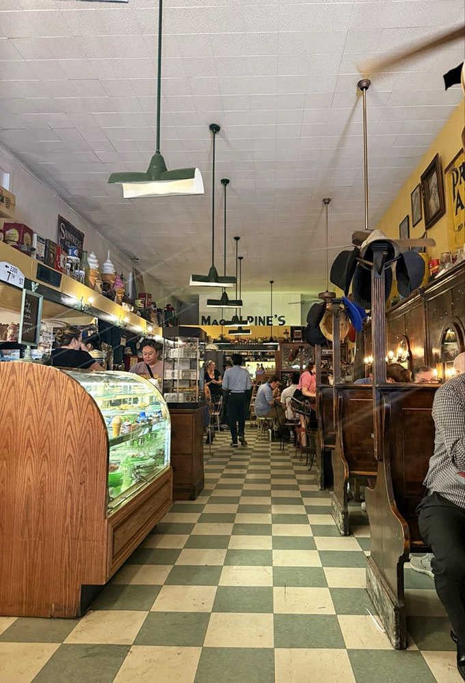 The long view reveals a time capsule where pendant lights illuminate paths to simpler pleasures and sweeter treats.