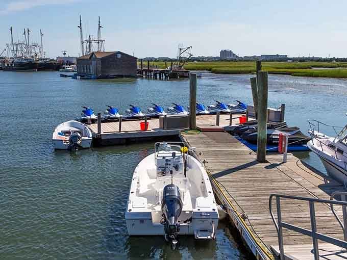 Marina life hums quietly where vessels line up like patient students, waiting for their next adventure on the water.
