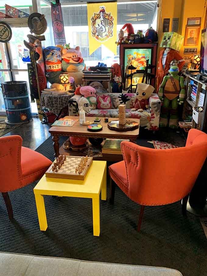 Velvet chairs and a chess set create the perfect lounge spot for strategic thinking between arcade battles.