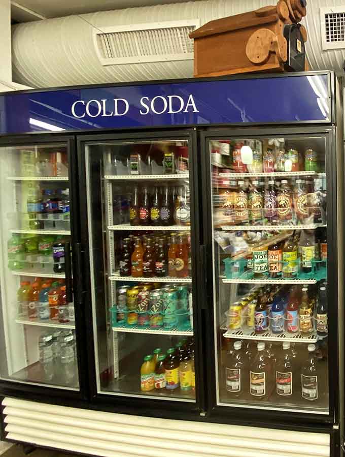A cold soda case featuring craft beverages and nostalgic favorites, because even your drink deserves to be special here.