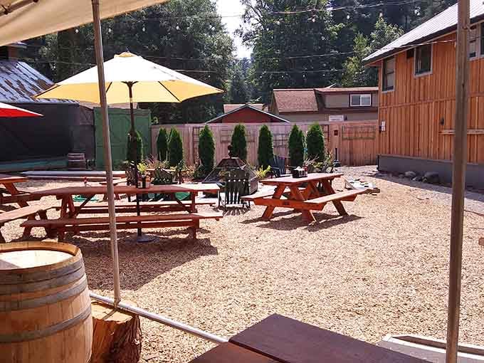 An outdoor patio with picnic tables and umbrellas, perfect for enjoying your meal while pretending you're on a permanent vacation.