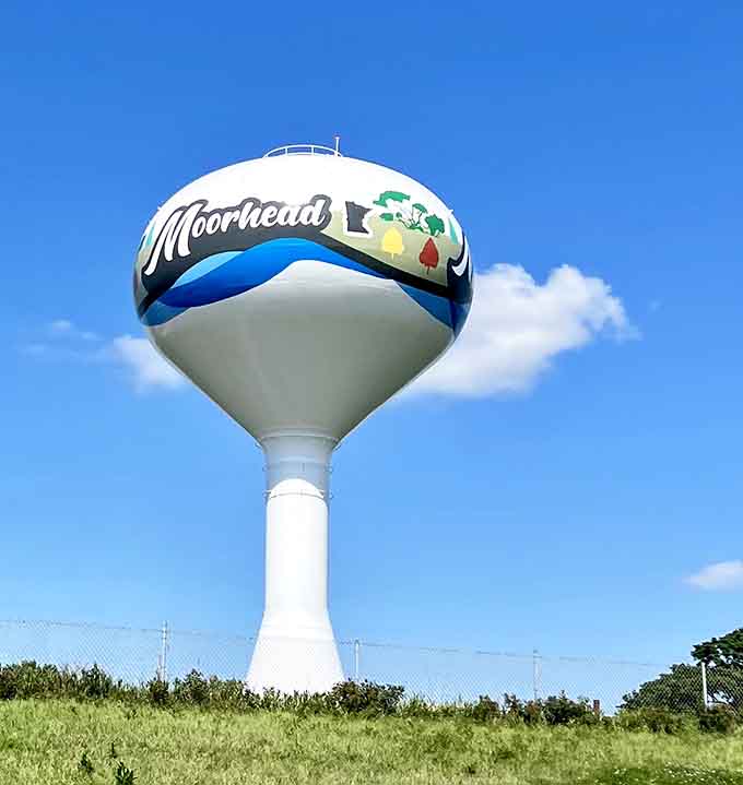 Moorhead's water tower declares civic pride against blue skies, a landmark visible for miles around the flat prairie.