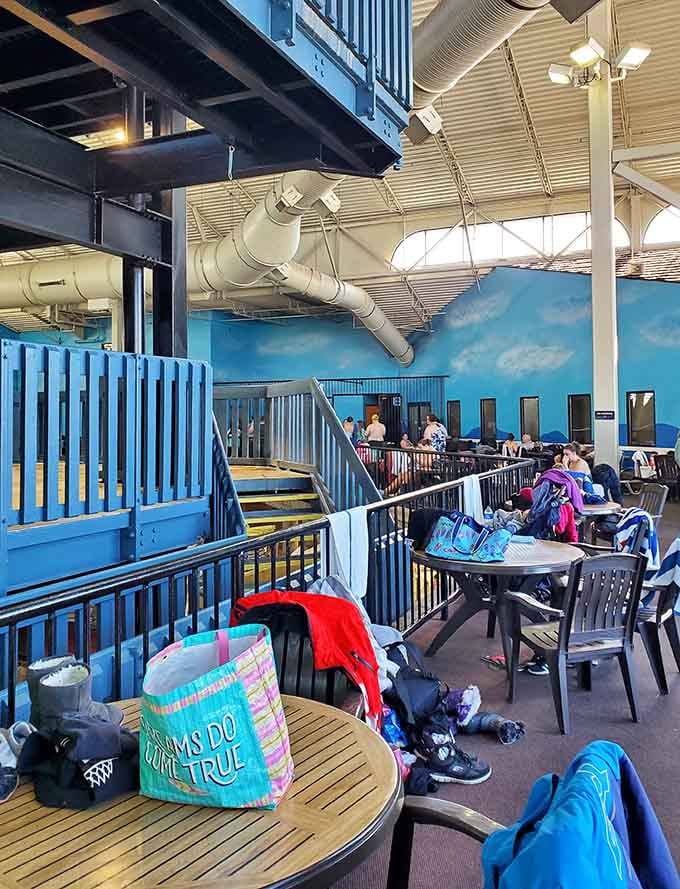 Seating areas strategically placed for parents who've mastered the art of relaxing while technically still supervising the chaos.