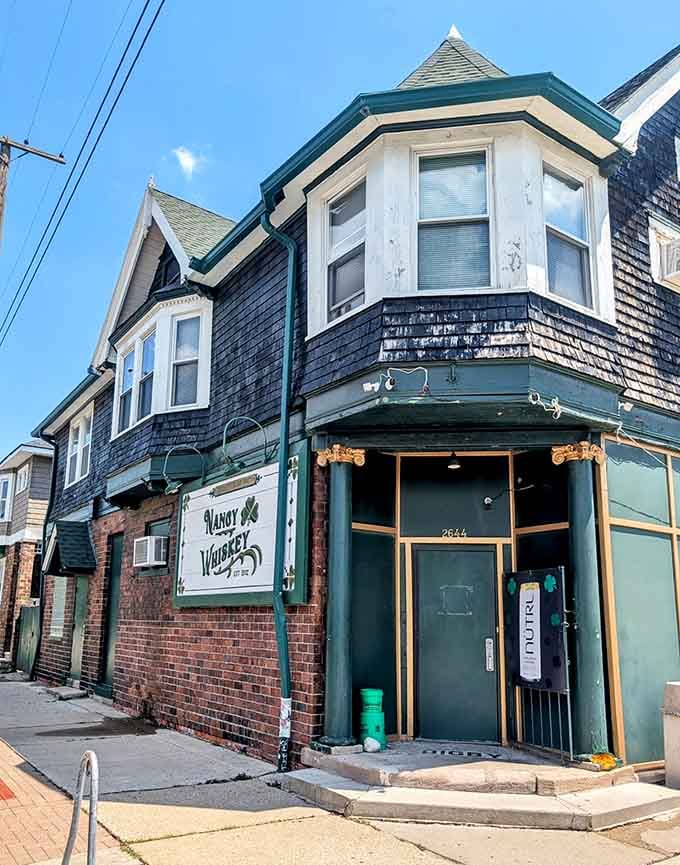 The Victorian architecture frames that welcoming corner entrance, where Corktown's past and present meet every single night.