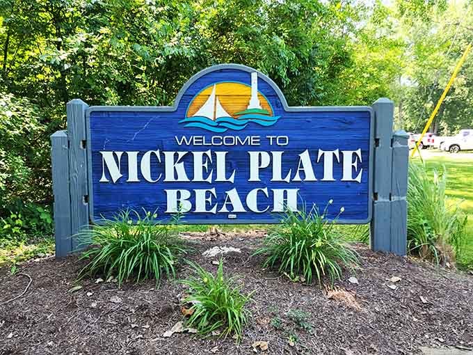 The welcome sign that greets you like an old friend, promising sand, water, and zero pretension ahead.