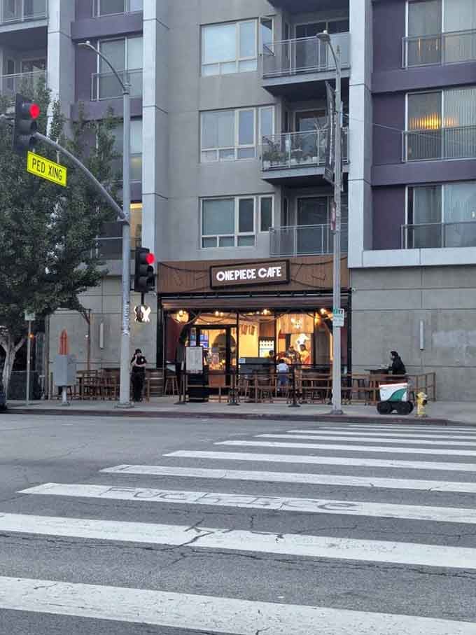As twilight falls, the cafe glows like a beacon for weary travelers seeking good food and great company.