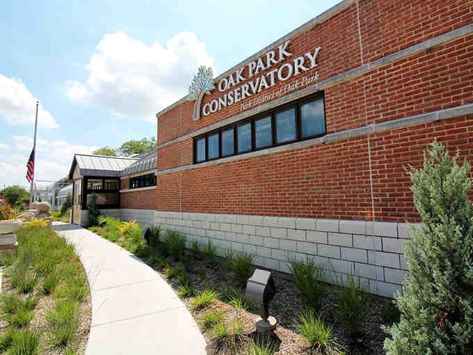 The conservatory's exterior promises botanical adventures inside, beckoning visitors to escape everyday life momentarily.