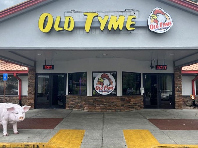 That welcoming pig statue outside knows exactly what you're here for: authentic Southern food done absolutely right.