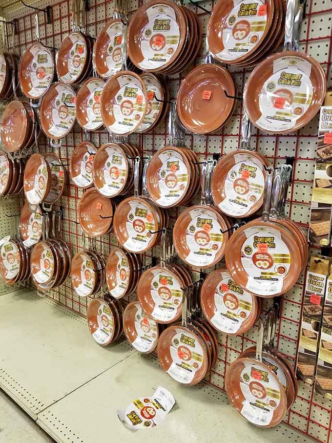 Copper pans hanging like kitchen artwork, ready to make your cooking look professional even if you're still learning.