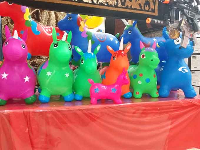 Rainbow unicorns waiting to bounce into some lucky kid's life, because joy should always come in bright, inflatable packages.
