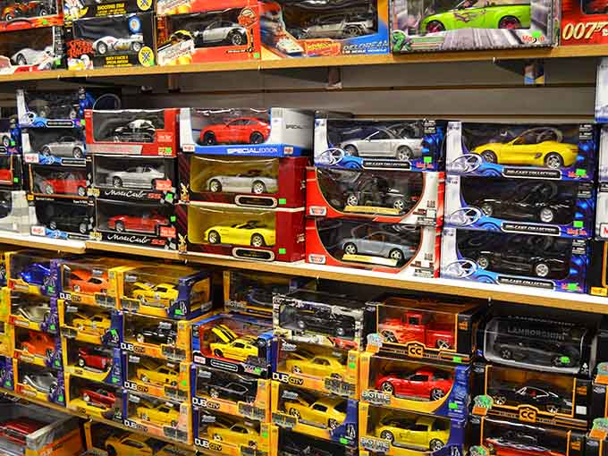 Die-cast toy cars stacked like a miniature dealership where every model is affordable and nobody checks credit.