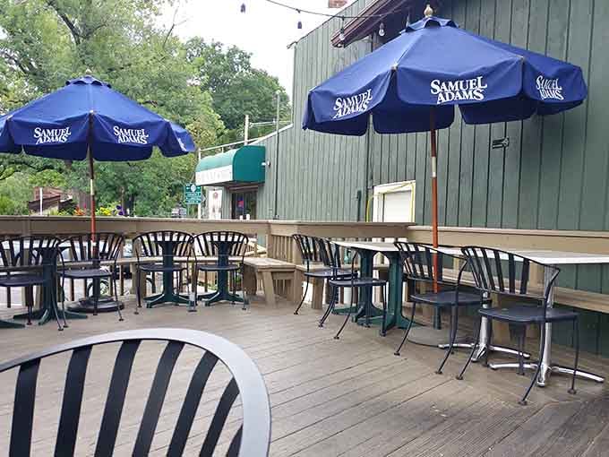 The outdoor patio with Samuel Adams umbrellas is where sunny afternoons transform into unforgettable dining memories instantly.