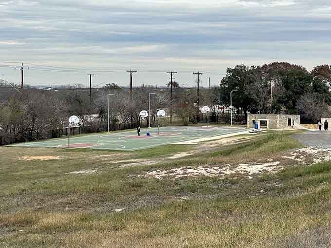 Basketball courts give older kids their own space to shoot hoops and settle neighborhood bragging rights.