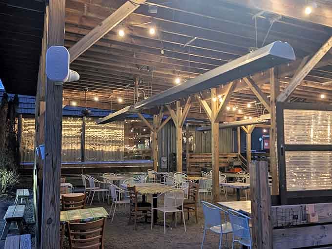 String lights transform the outdoor patio into an enchanted dining space where mountain air makes everything taste even better somehow.