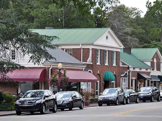 Downtown Pinehurst's brick buildings and tree canopy create shopping districts that actually encourage leisurely afternoon strolls together.