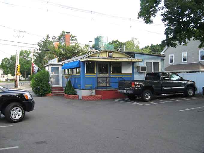 The parking lot view confirms you've found the real deal, not some modern imitation of diner glory.