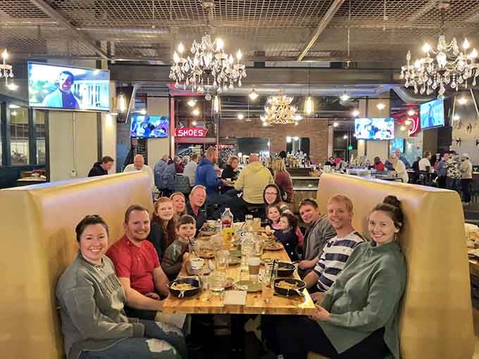 Happy faces around the table prove good food and entertainment create memories worth capturing on camera.