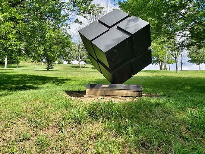 This tilted cube balances impossibly, making you question physics while admiring the sheer audacity of it all.