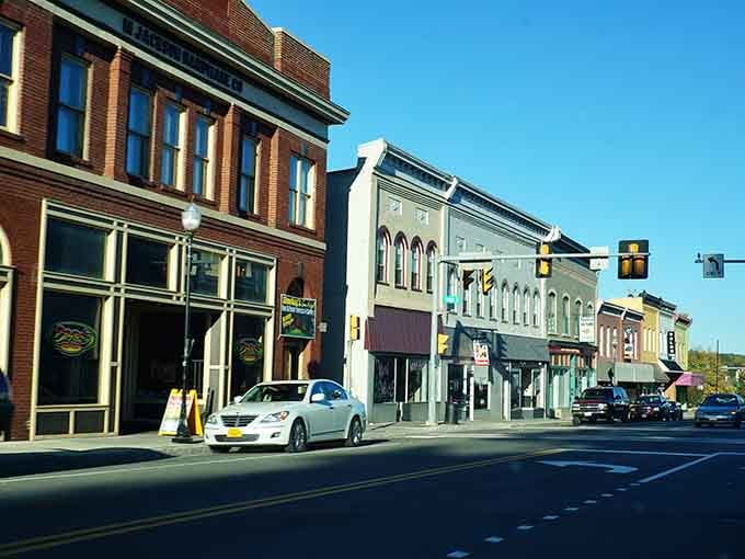 Colorful storefronts line the street under blue skies, inviting you to park and explore at your leisure.
