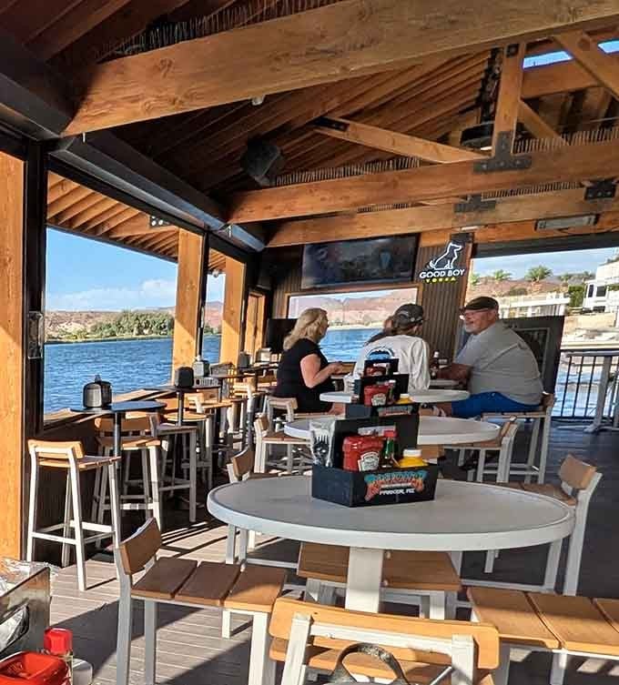 Diners enjoying their meals with water views capture exactly what makes this floating restaurant worth the drive to Parker.