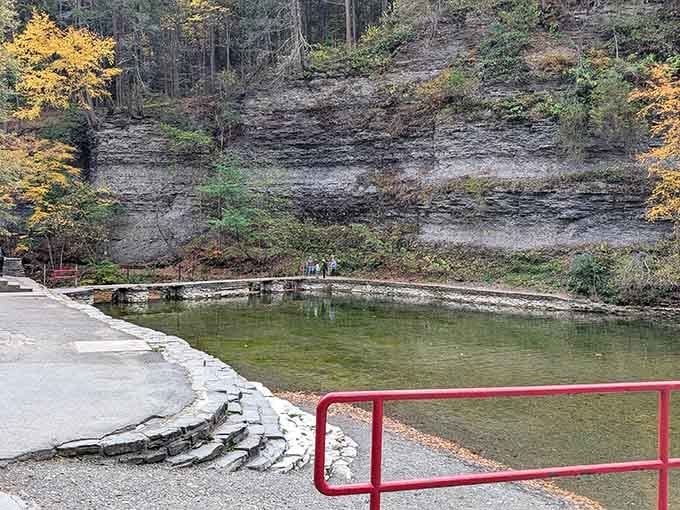 The swimming area's natural pool sits beneath layered rock walls, creating an outdoor experience that feels both ancient and refreshingly timeless.