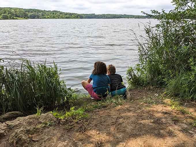 Two kids, one shoreline, and the kind of peaceful moment that makes you remember why getting outside actually matters.