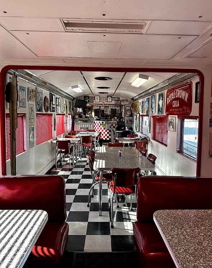 Looking down this narrow aisle of red booths and checkered floor feels like boarding the best train ever.