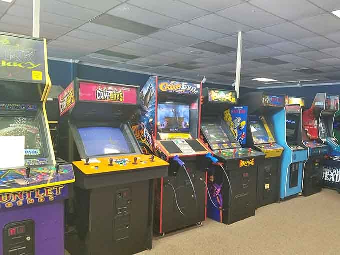 An entire wall of retro gaming goodness stretches before you, each cabinet a time capsule waiting to transport you back to simpler days.